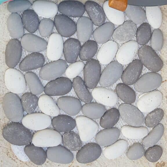 How To Tile a Patio Wall in a Day With Pebble Tiles - A Crafty Mix